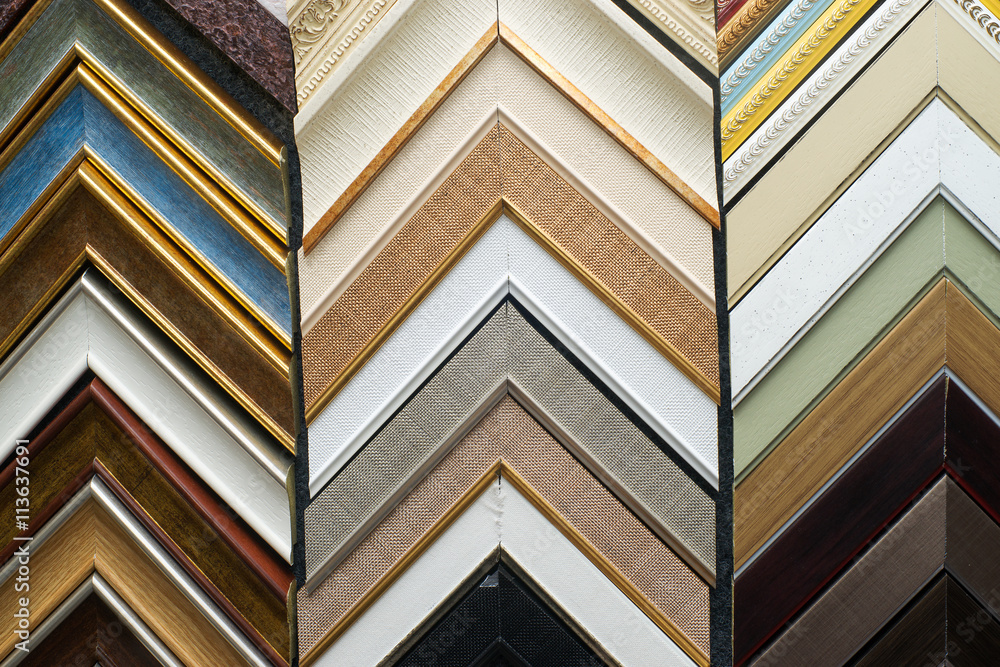 Craftsman working on frame in frame shop. Professional framer hand ...