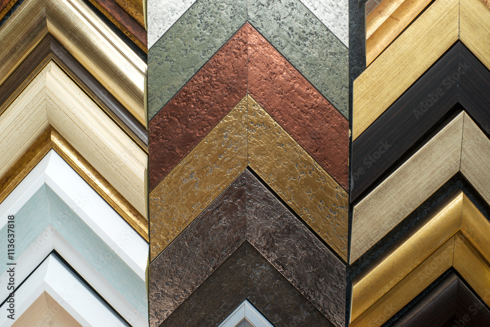 Craftsman working on frame in frame shop. Professional framer hand ...