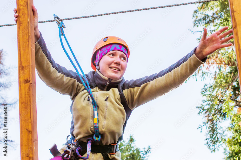 girl climbs into ropes course Stock-Foto | Adobe Stock