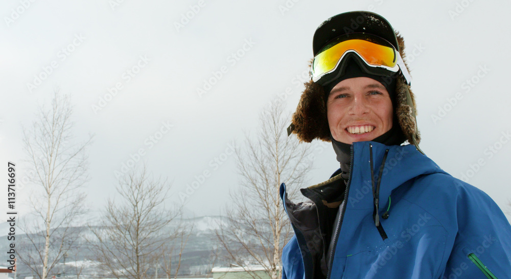 Male Caucasian Skier Profile Portrait Holding Skis Wearing Goggles Hat ...