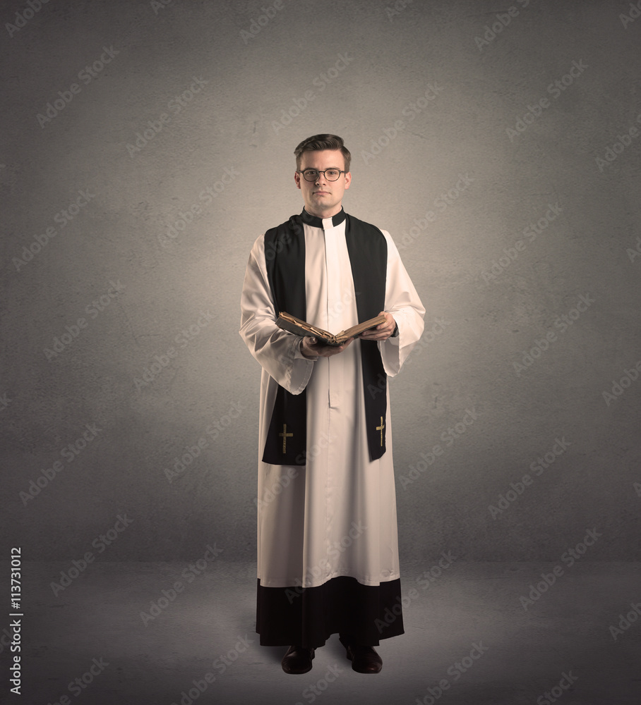young priest in giving his blessing Stock Photo | Adobe Stock
