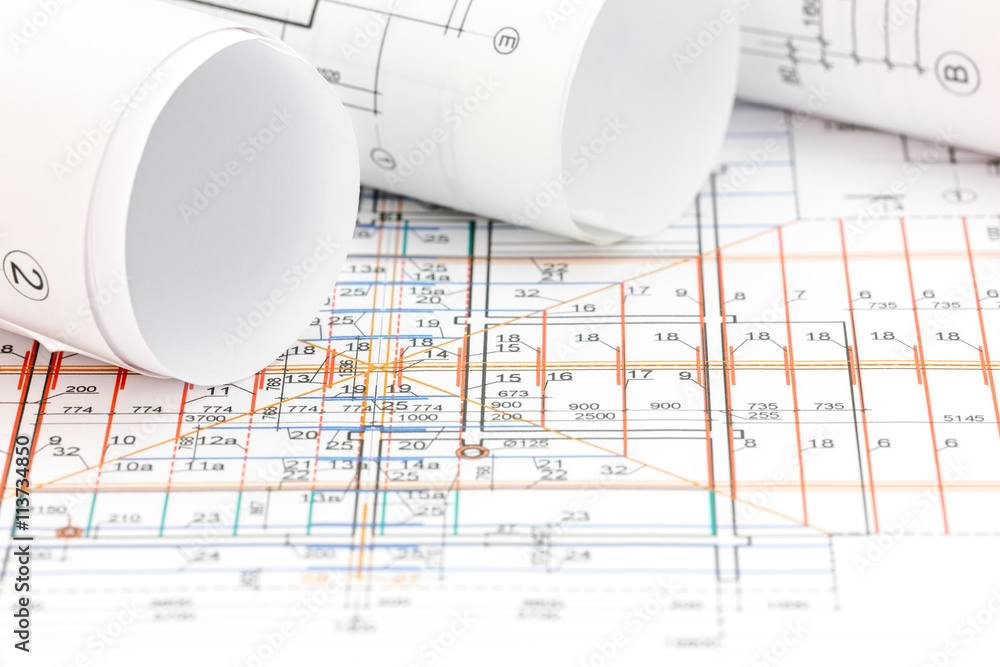 engineering drawing and rolls of floor plan blueprints Stock Photo ...