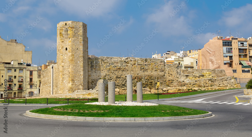 Tower of the medieval wall that hides the entrance to the Roman Stock ...