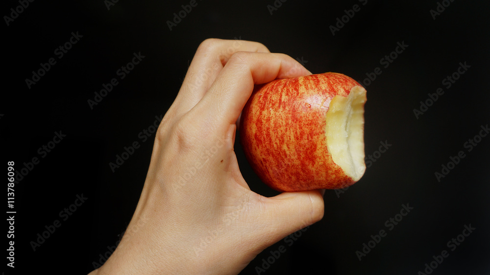 Hand Hold Bite Red Apple On Dark and Black Background Stock Photo ...