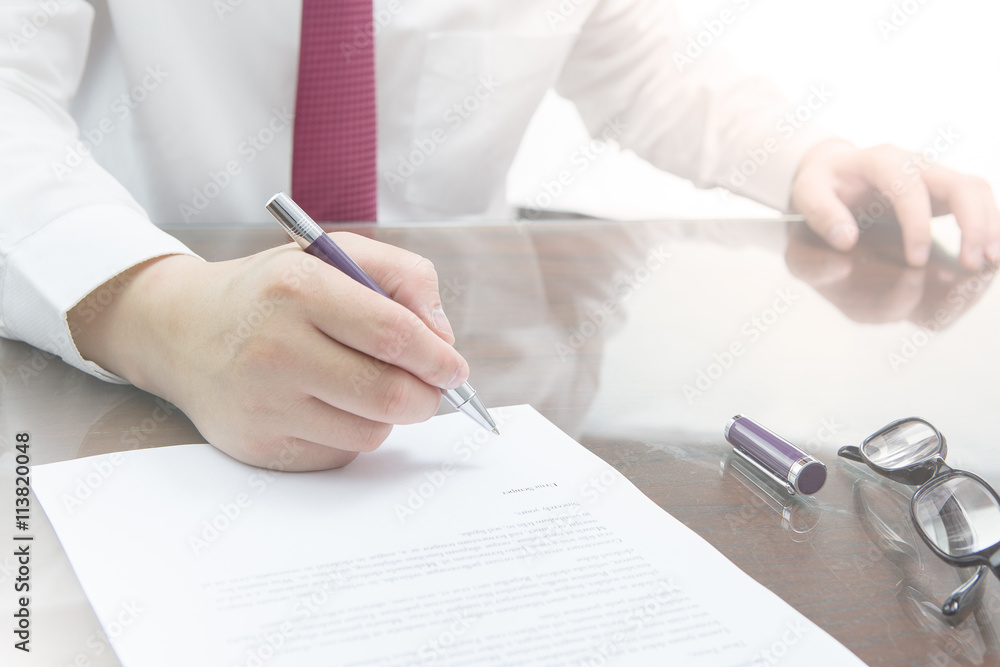 Businessman is signing a contract, business contract details. Or ...