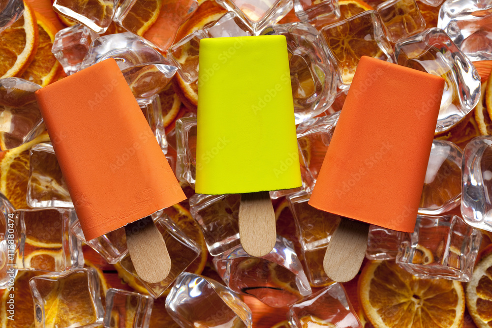 Three ice lollies and ice cubes Stock Photo | Adobe Stock