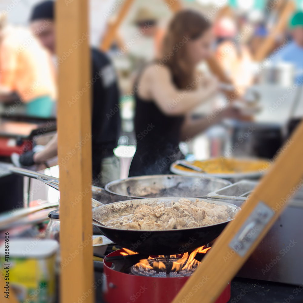 Cheff cooking traditional African stew on street stall on international ...