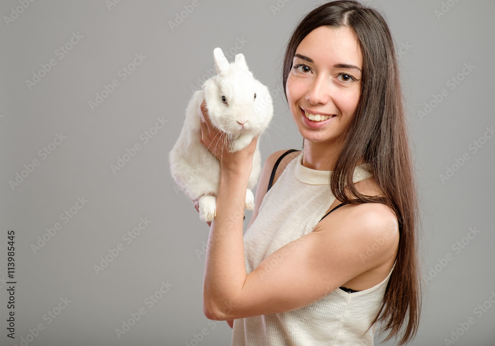 Woman with white rabbit foto de Stock | Adobe Stock