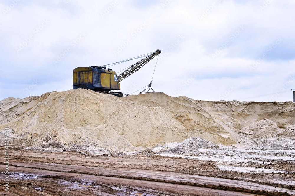 Working digger in a quarry produces sand Stock-Foto | Adobe Stock