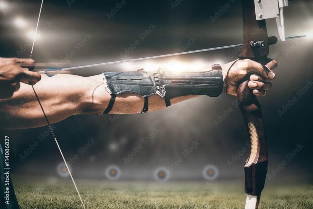 Composite image of close up of man stretching his bow Stock Photo ...