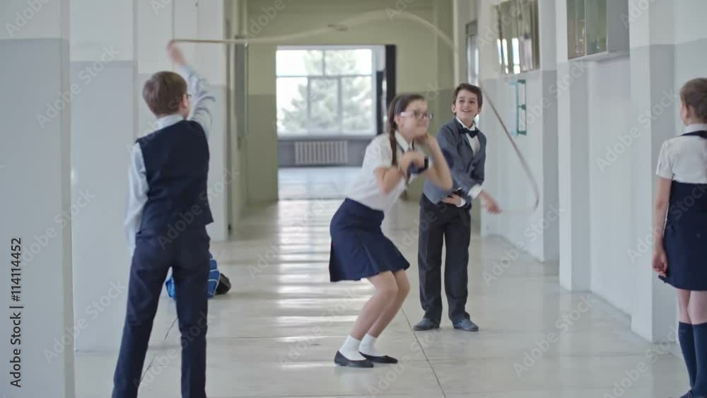 Vídeo do Stock: Girl jumping rope at school and gets hurt accidentally ...