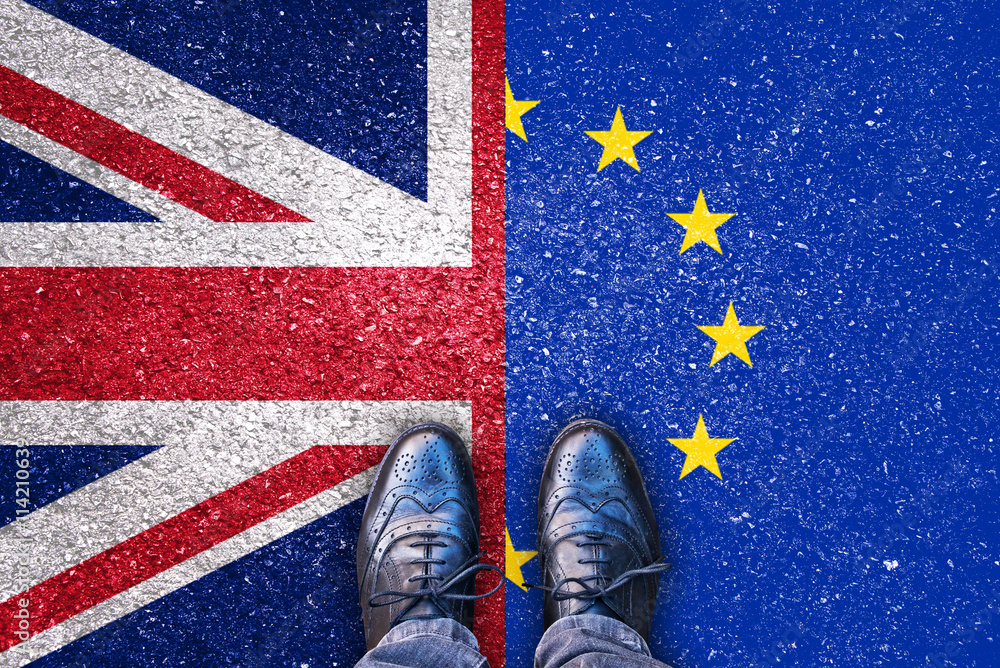 Brexit, flags of the United Kingdom and the European Union on asphalt ...