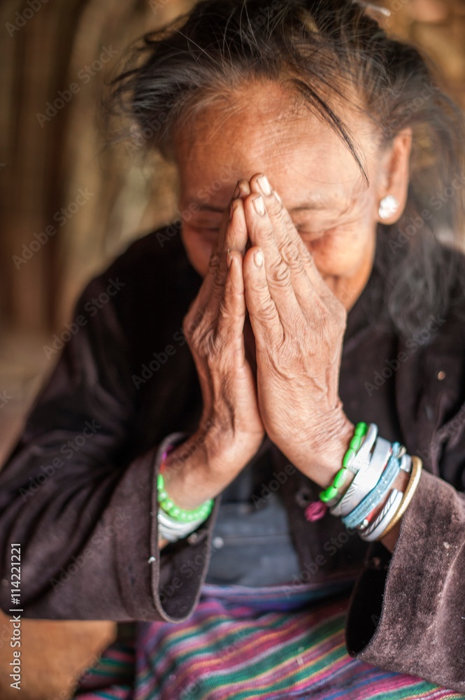Senior woman with hands covering face, Shan State, Keng Tung, Burma ...