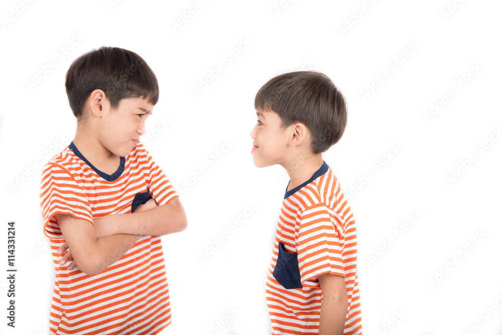 Little sibling boy fighting brother on white background Stock Photo ...