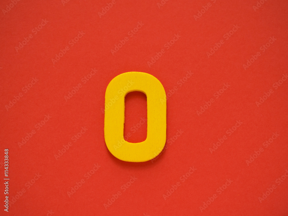 Capital letter O. Yellow letter O from wood on red background. Alphabet ...