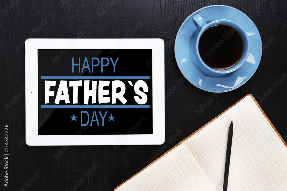 Happy father's day concept. Tablet with cup of coffee and notepad on ...