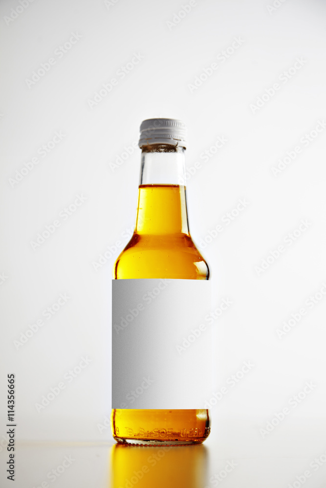 Transparent glass sealed bottle isolated on simple background with ...