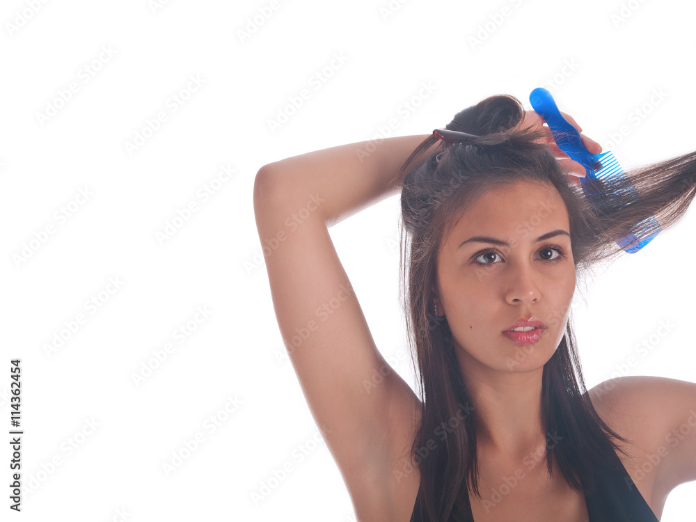 young woman fixing her hair Stock Photo | Adobe Stock