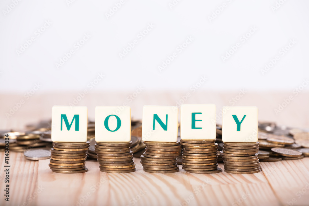 Generic tiles money coins light natural wooden abstract Stock Photo ...