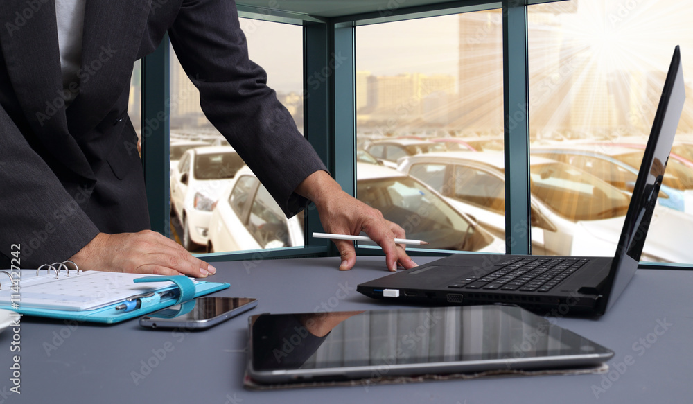 bussiness man working in office with New Cars in Stock. Car Dealership ...