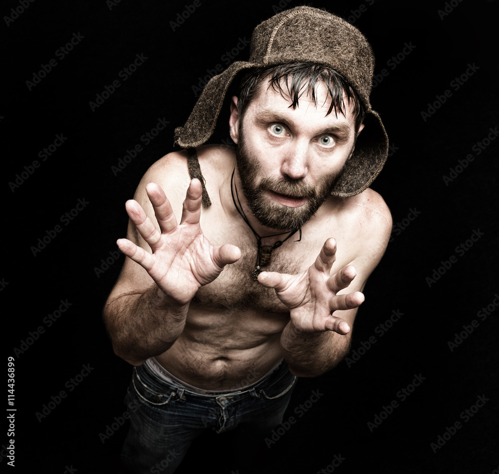 Dark portrait of scary evil sinister bearded man with smirk, makes ...