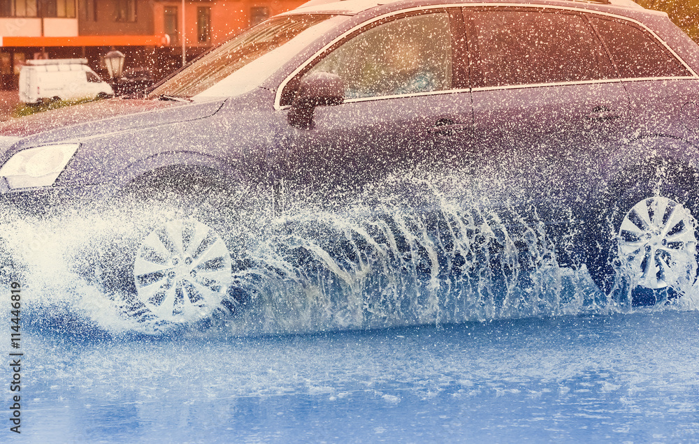 car rain puddle splashing water Stock Photo | Adobe Stock