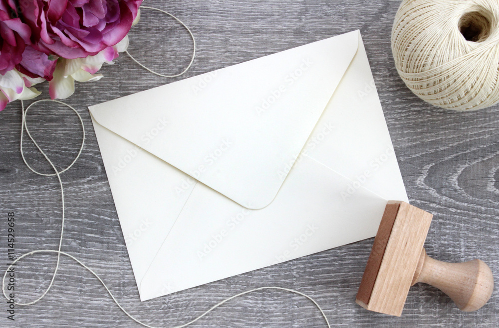 Mockup of envelope with a rubber stamp next to it. Modern trend ...