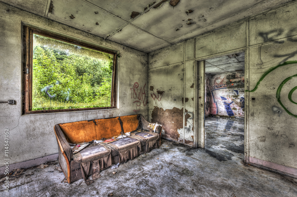 Rotten sofa in an abandoned room Stock Photo | Adobe Stock