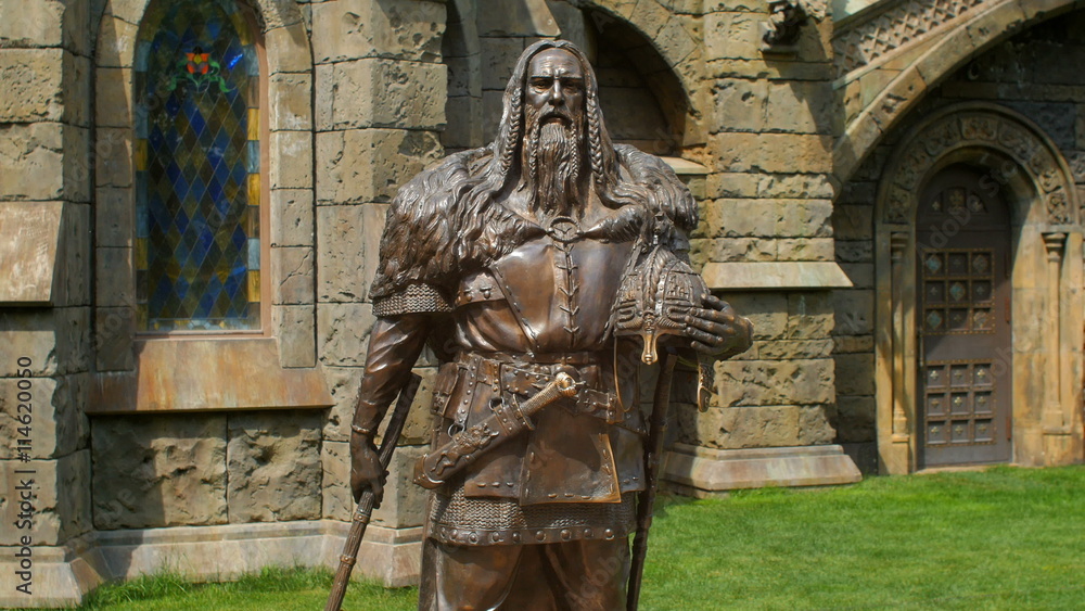 bronze statue of medieval knight on castle background Stock Photo ...