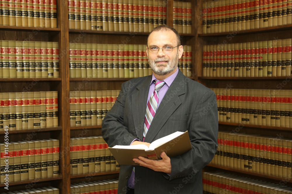 Portrait of a middle aged male lawyer, in law library Stock Photo ...