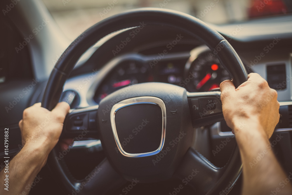 Hands on steering wheel Stock Photo | Adobe Stock