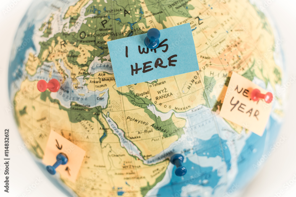 I was here - globe map with colorful pins and post-it notes marking ...