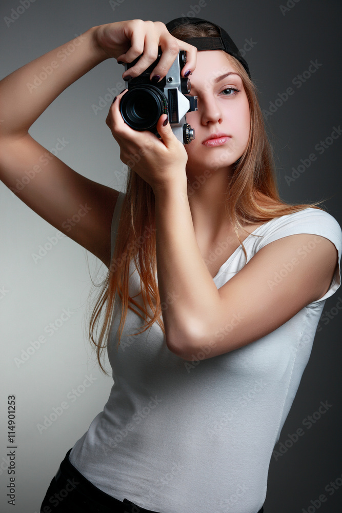 Photographer girl shooting images. Attractive blonde woman takin Stock ...