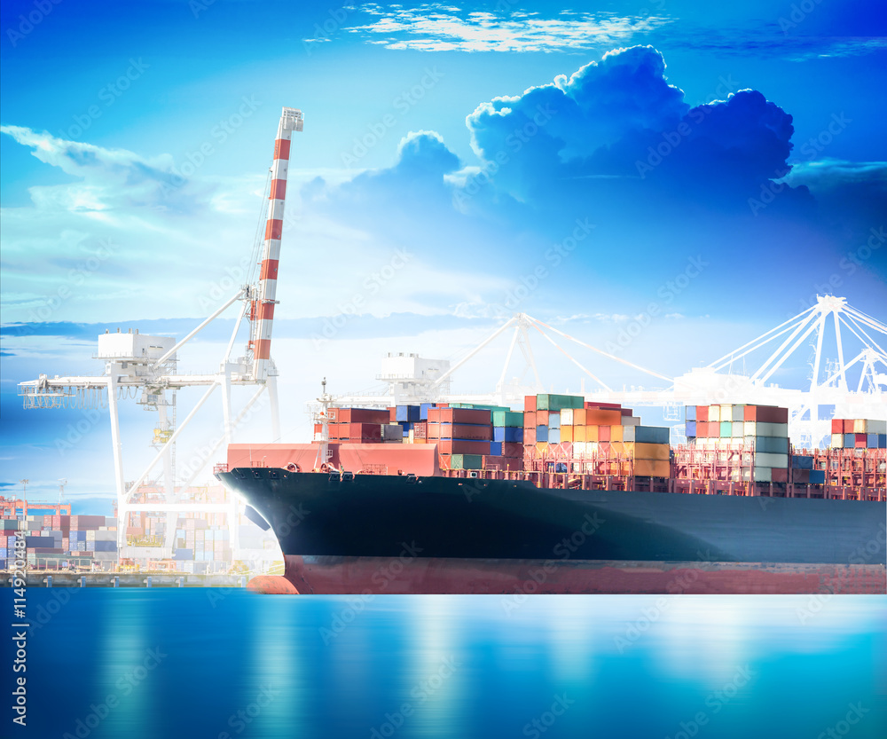 Cargo Container Ship with working crane bridge in shipyard at blue sky ...
