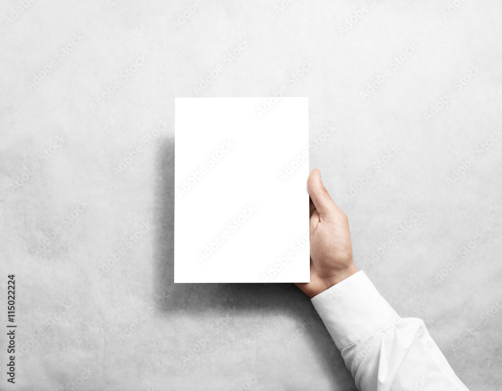 Hand holding blank white brochure booklet in the hand. Leaflet ...