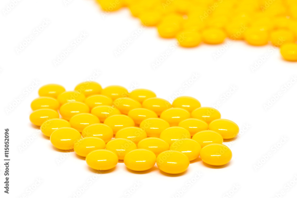 yellow sugar coated tablets pills Stock Photo | Adobe Stock