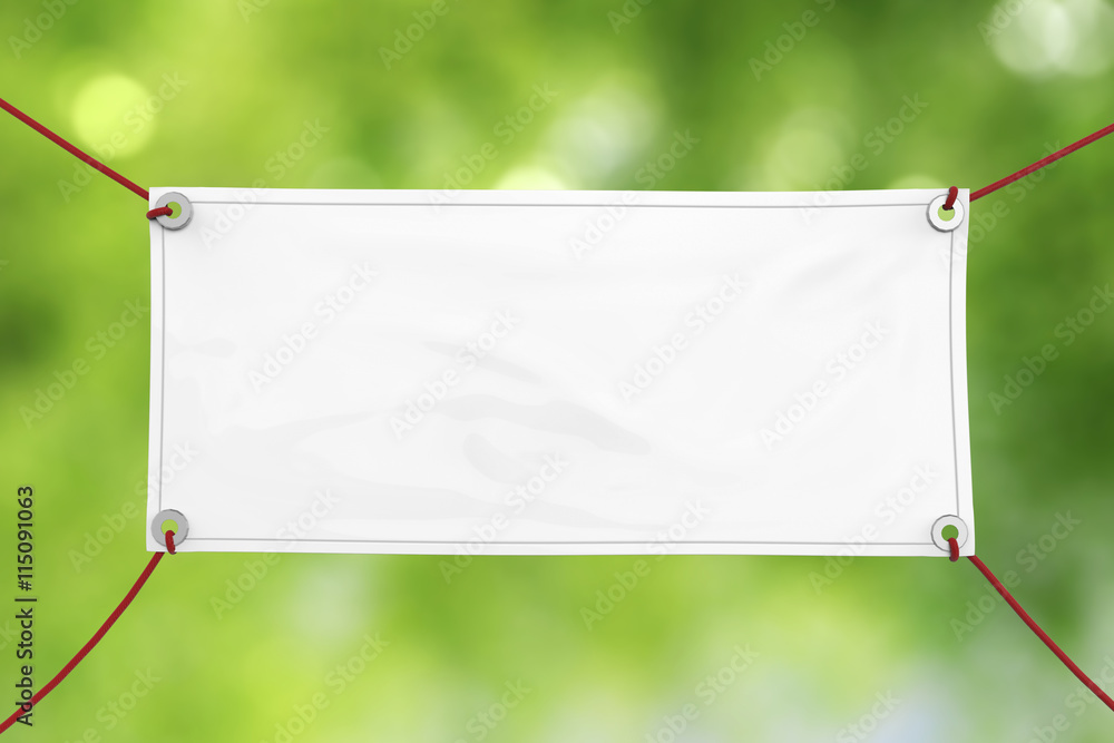 blank vinyl banner hanging on green background Stock Photo | Adobe Stock