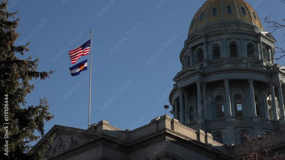United States and Colorado Flags Flying Over the Colorado State Capitol ...