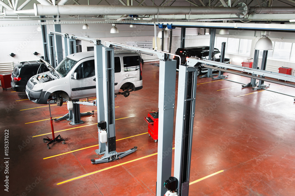 Garage with cars on service or repairing. Top view on professional ...