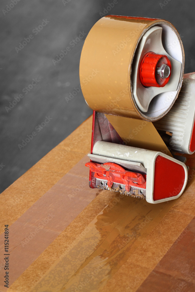 Taping box tape dispenser / Taping a cardboard box with a tape ...