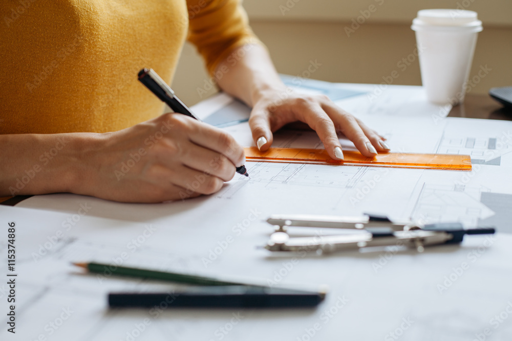 Technical drawing. Woman hands drawing blueprints Stock Photo | Adobe Stock