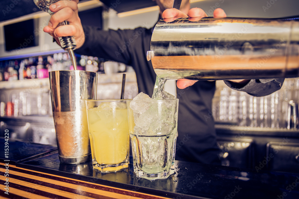 Pouring alcohol. Stock Photo | Adobe Stock