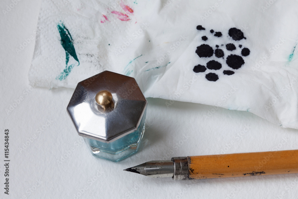 Wooden fountain pen nib with inkwell, blotter, napkin. White paper ...