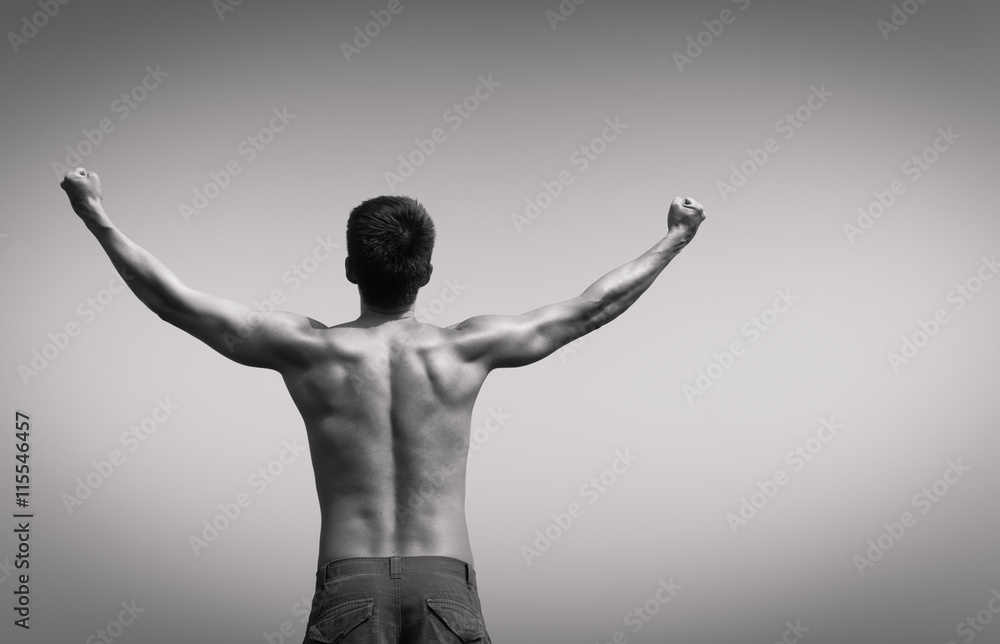 Strong confident male with his arms up in the air. Victory and winning ...
