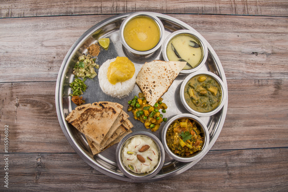 typical maharashtrian food served in a steal plate, marathi food ...