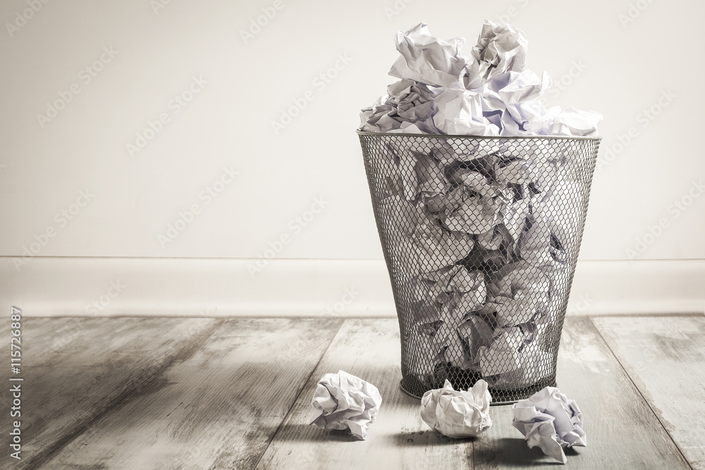 Crumpled paper in the trash can Stock Photo | Adobe Stock