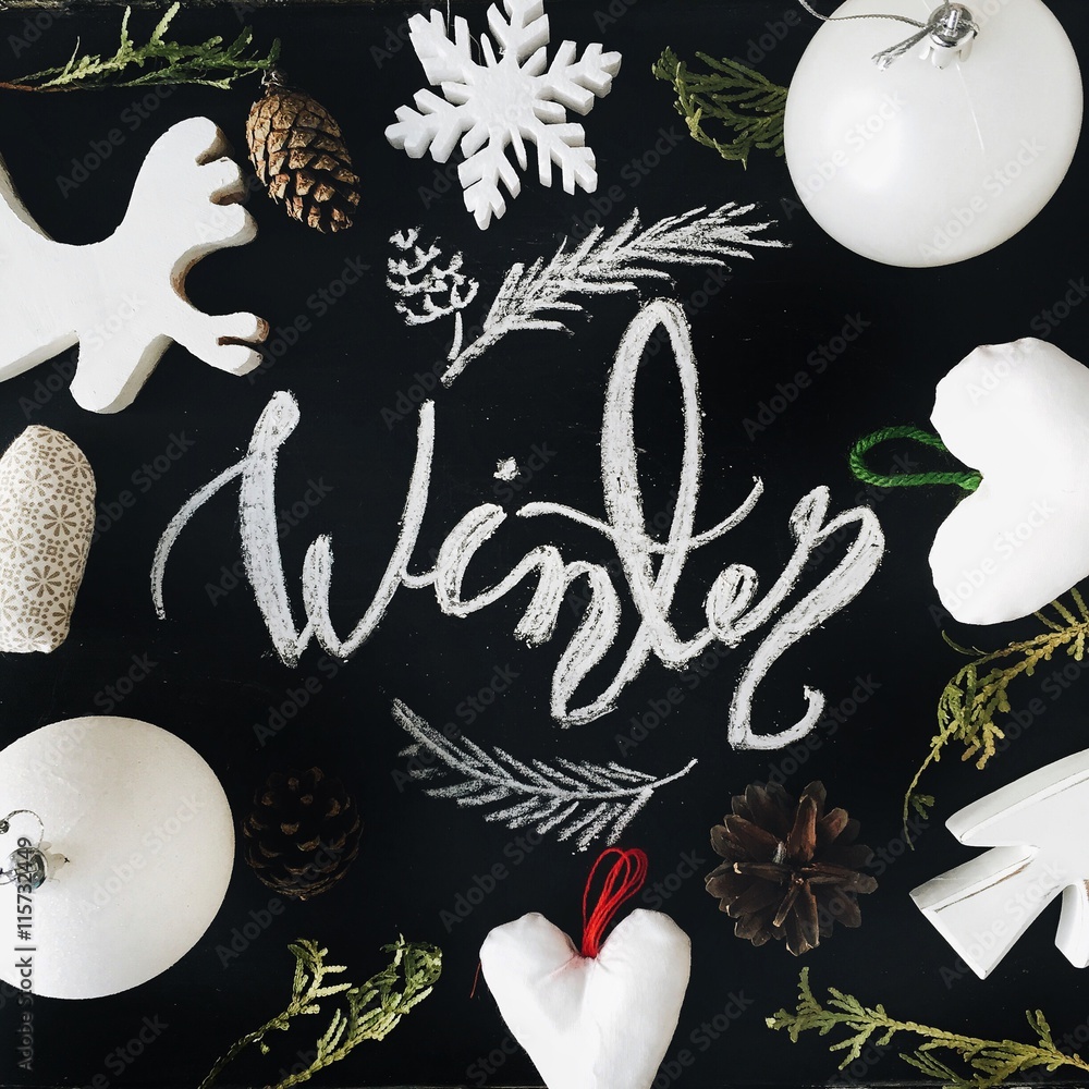 Hand-written word "Winter" made in modern calligraphy style at black ...