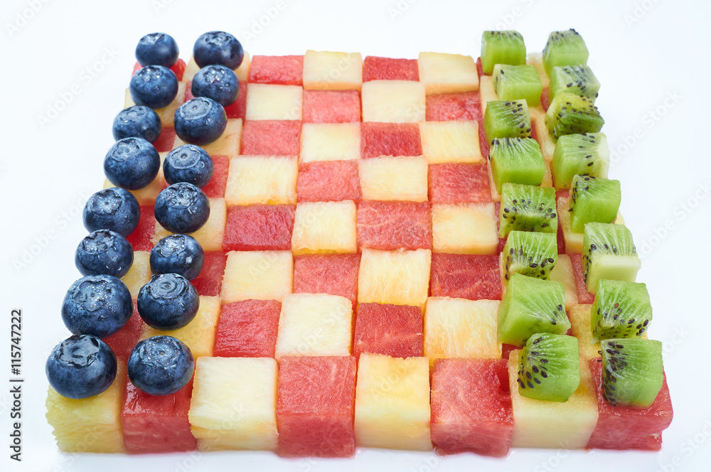 Fun food. Checkers made from fruits Stock Photo | Adobe Stock