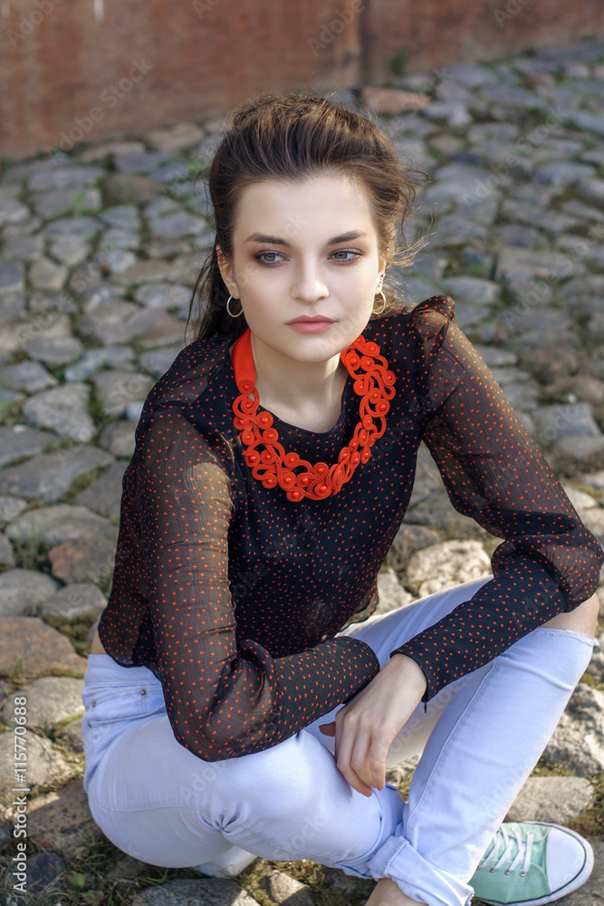 Girl model demonstrates red soutache jewelry Stock Photo | Adobe Stock