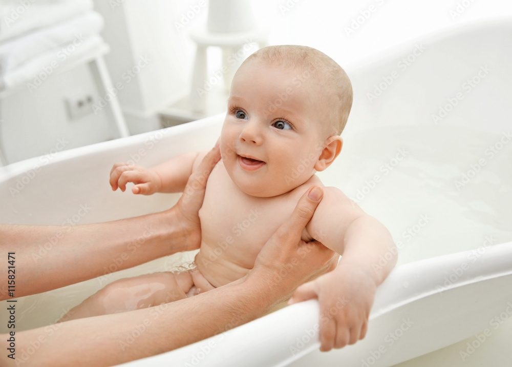 Cute baby bathing Stock Photo | Adobe Stock